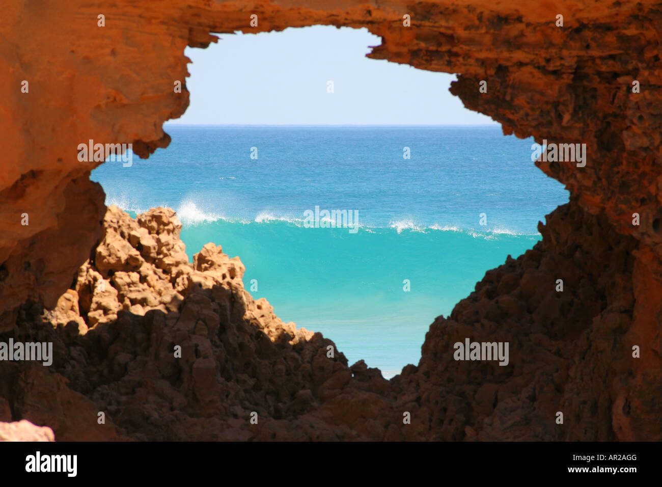Wave breaking looking though Needle Eye Venus Bay South Australia Stock ...