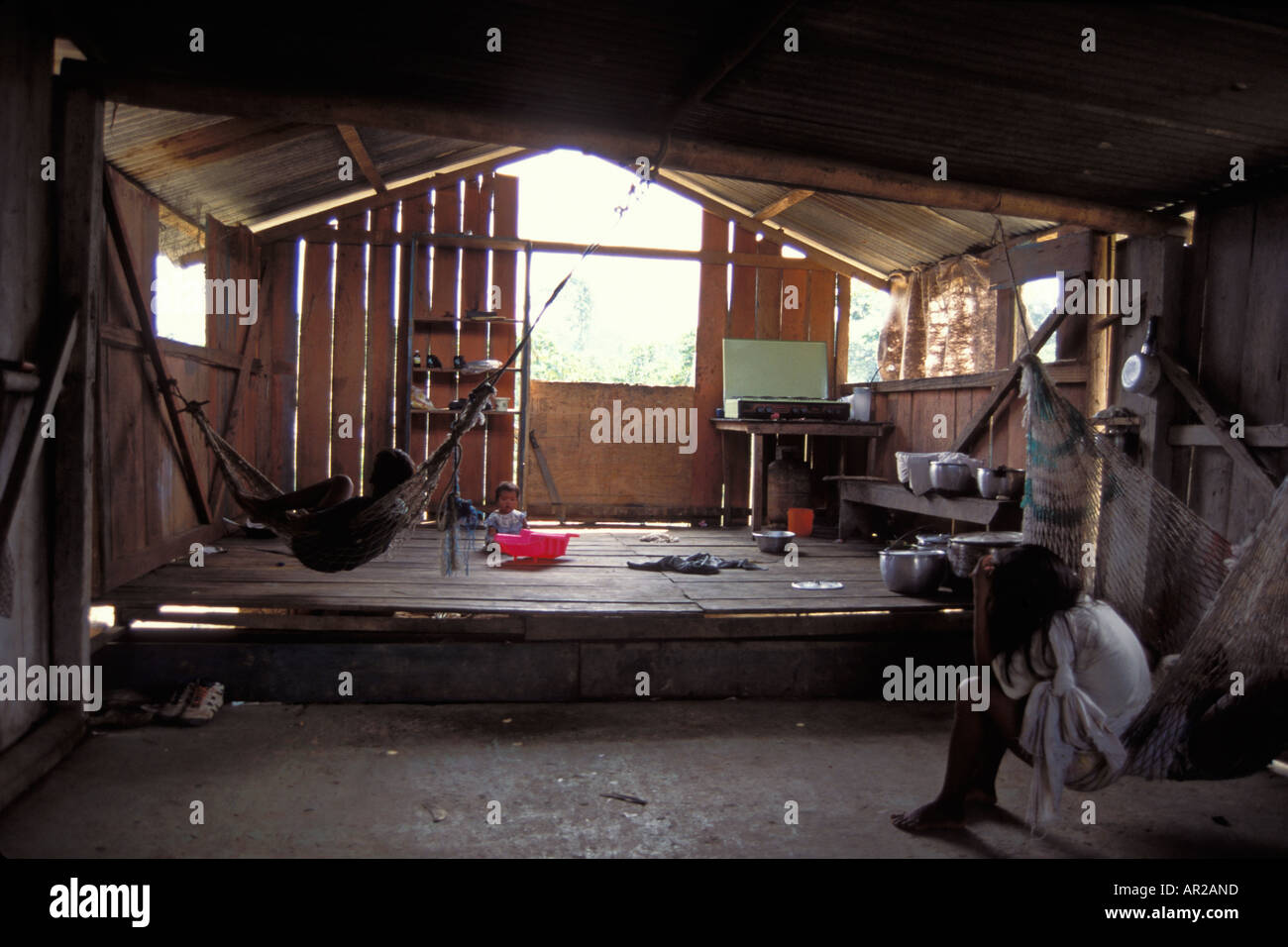 native Warani woman in her house which is an old army barrack of some ...