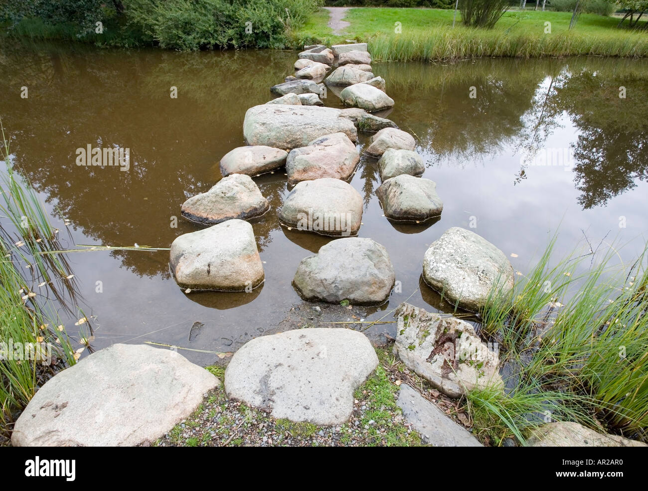 Stepping across rocks hi-res stock photography and images - Alamy