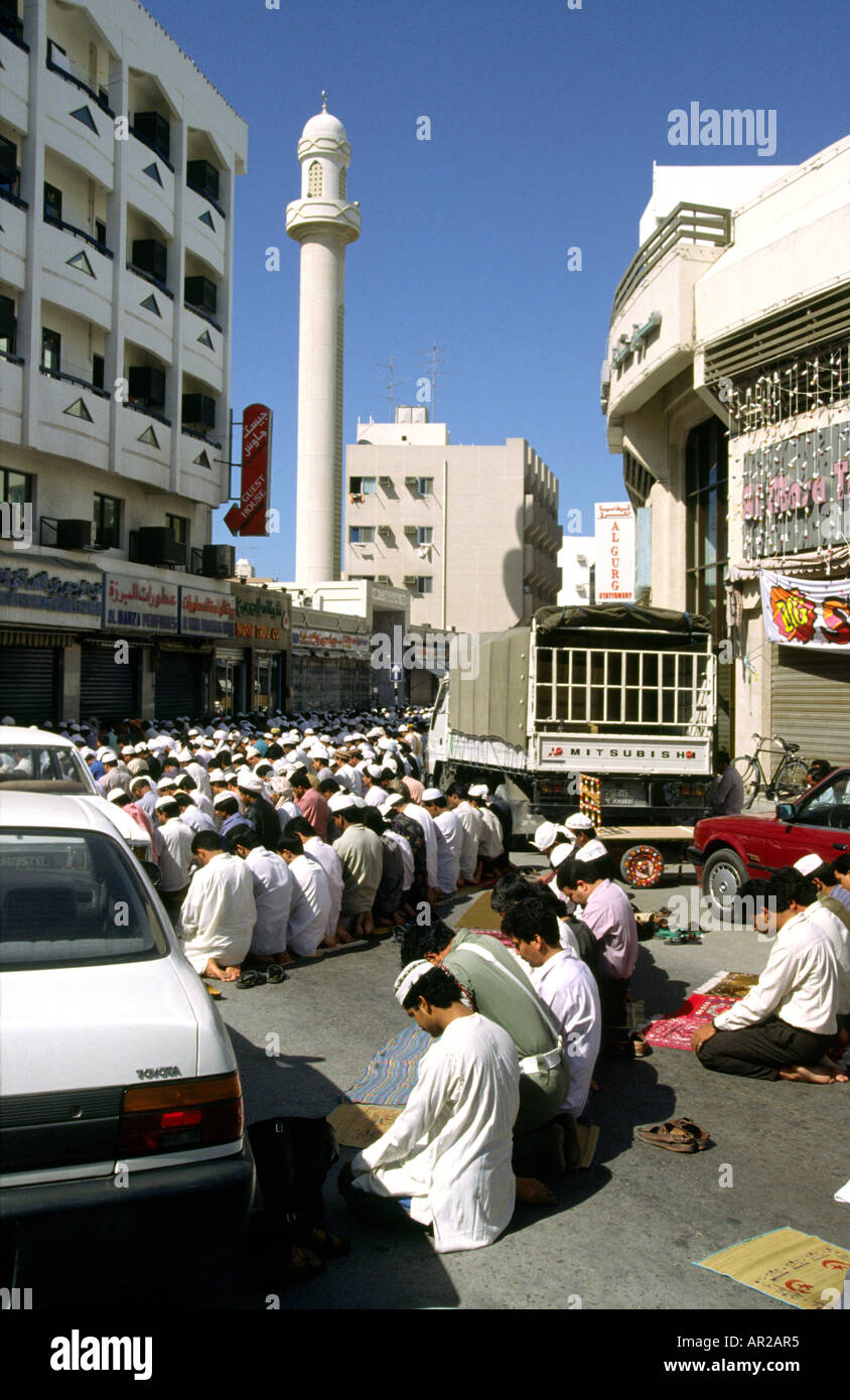 UAE Dubai Religion muslim worshippers praying in street outside Mosque ...