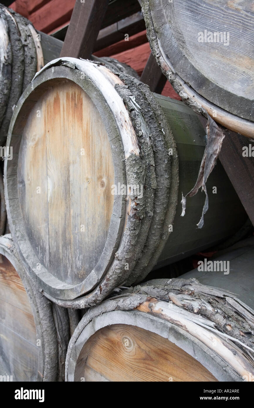 old wooden barrels for pine wood tar export Stock Photo - Alamy