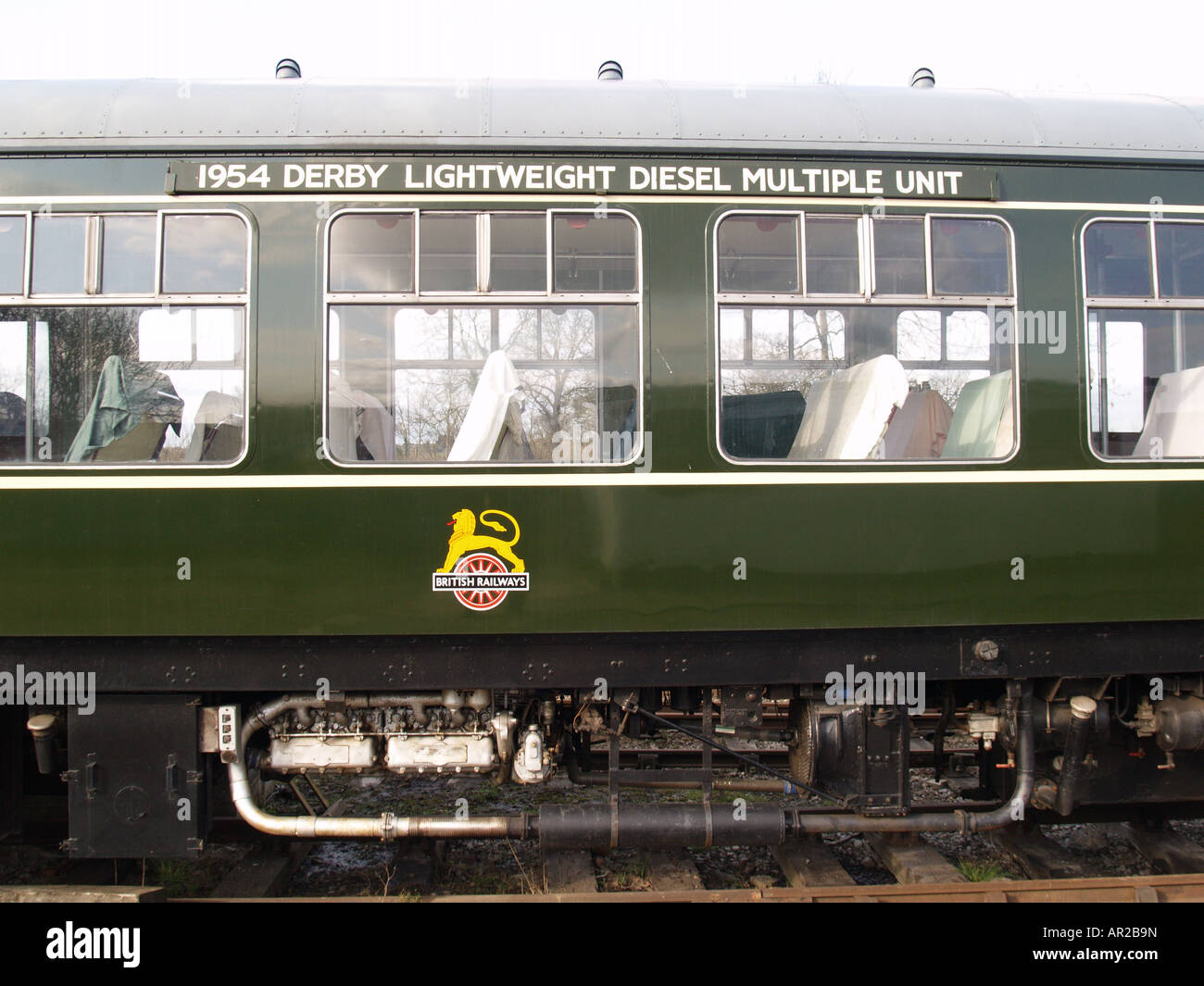 railway carriage windows dark green train Stock Photo - Alamy