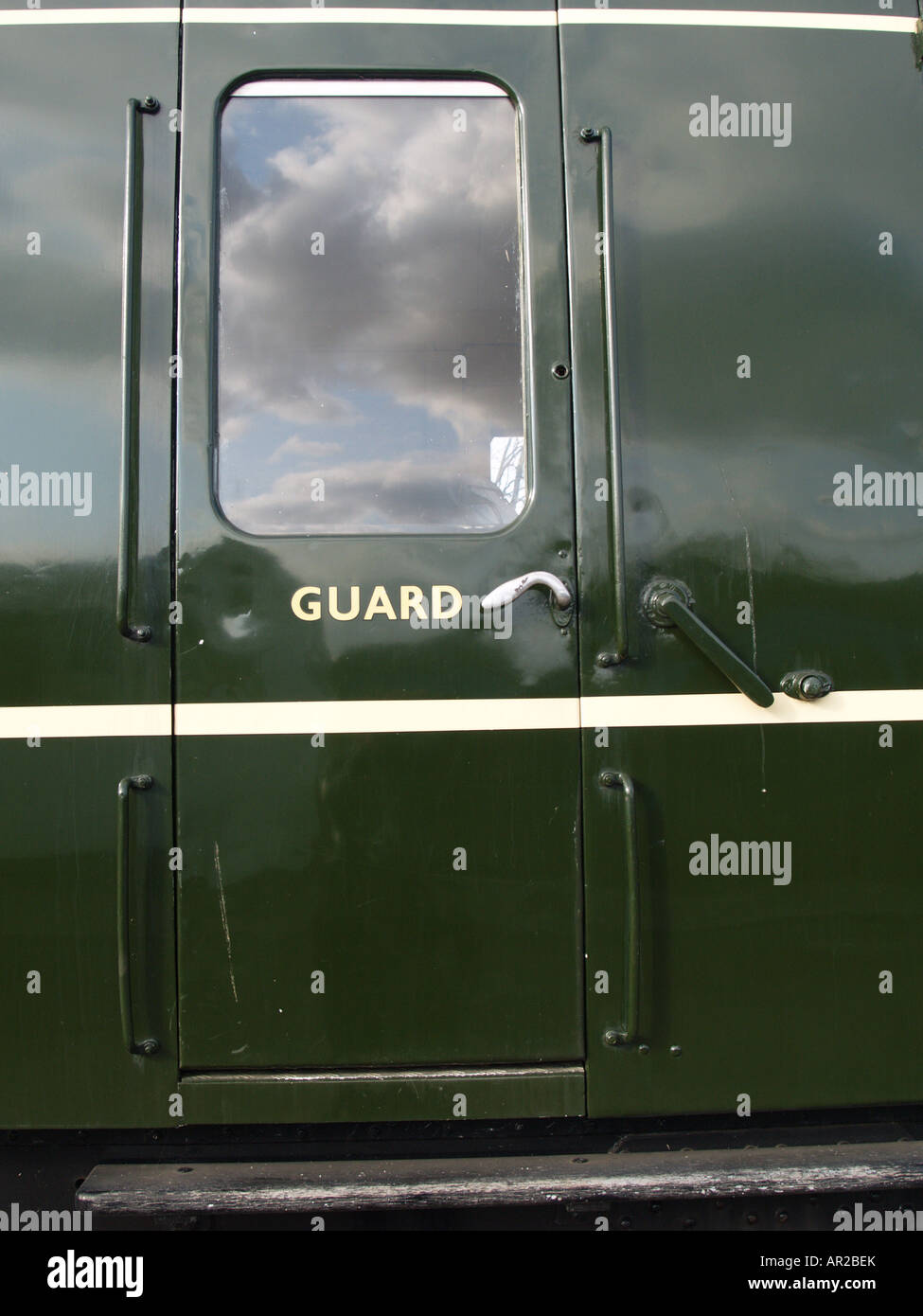 railway carriage windows dark green train Stock Photo - Alamy
