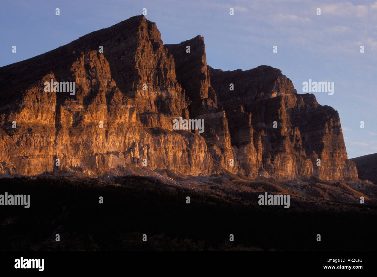 sunset on cliff faces in Glacier National Park Montana Stock Photo - Alamy