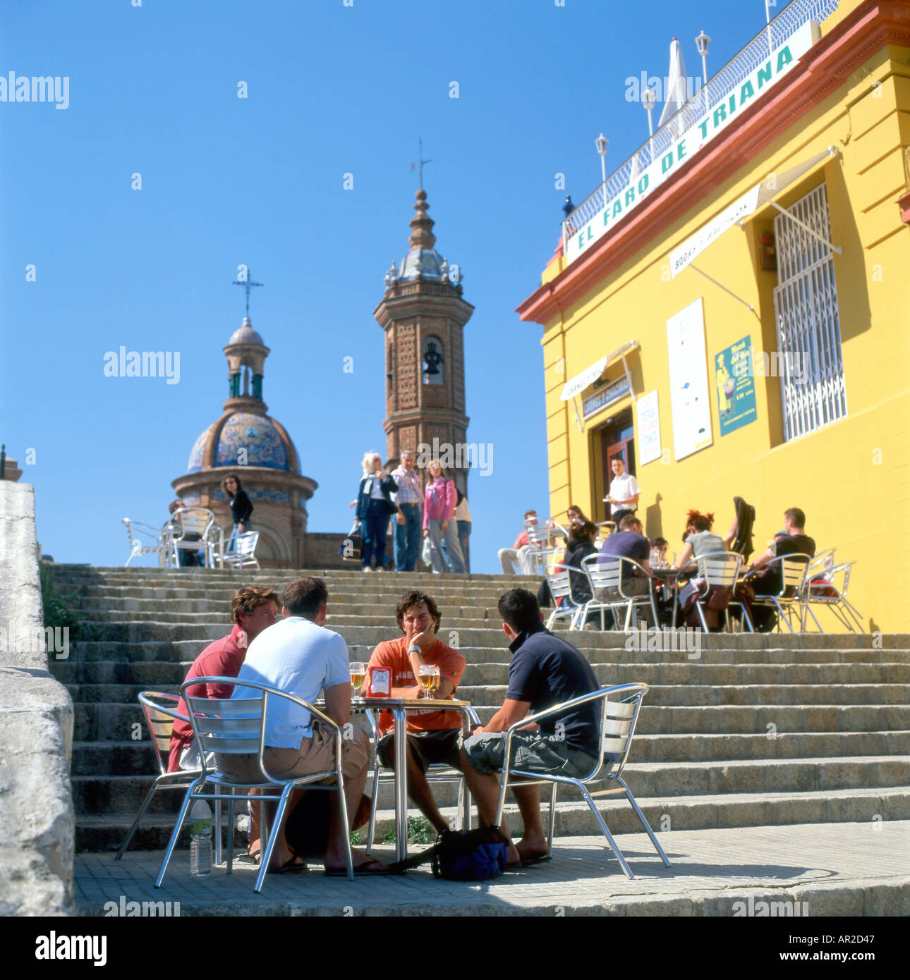 Young men drinking beer in the Plaza del Altozano Triana Seville in ...