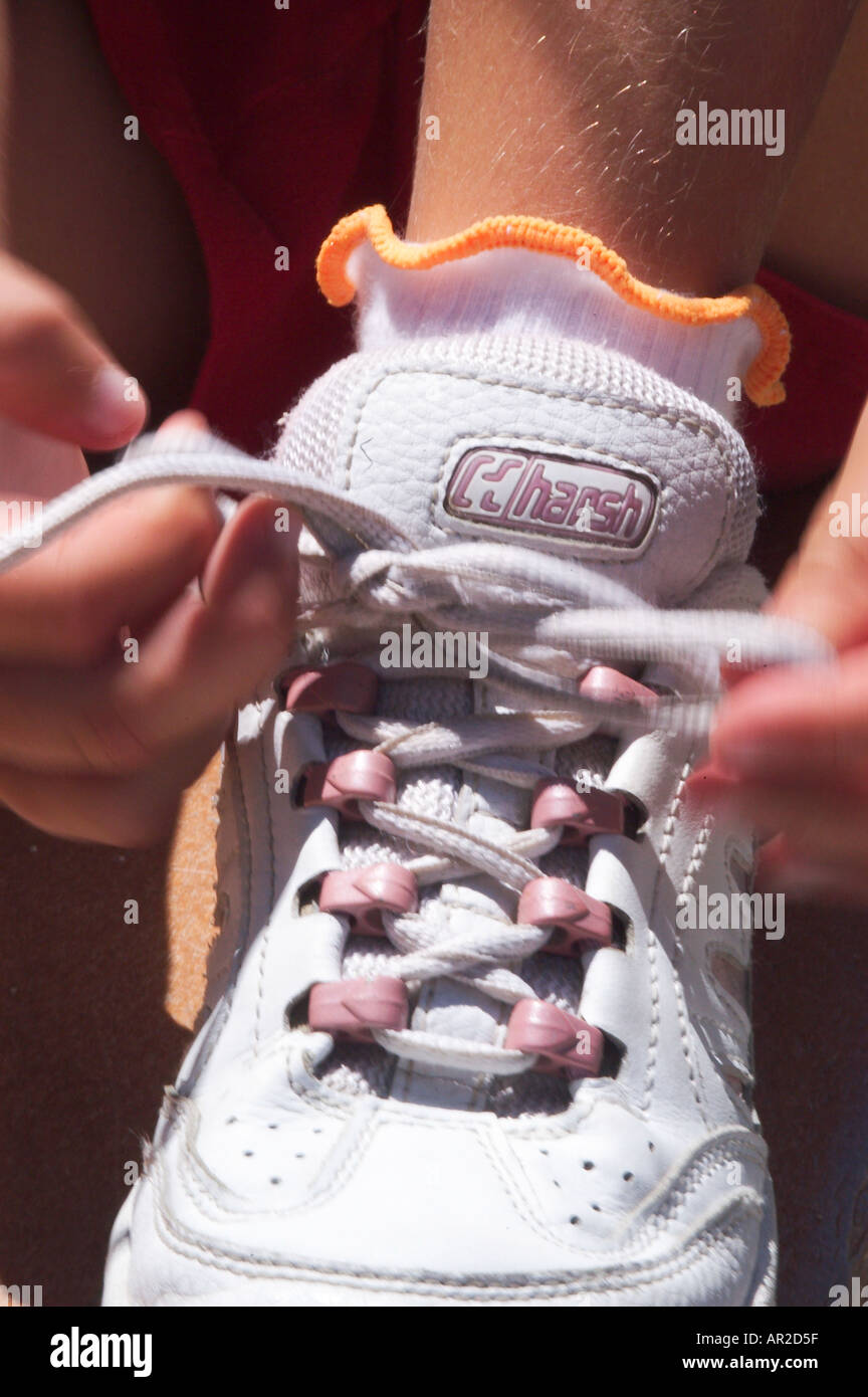 Tieing sneakers hi-res stock photography and images - Alamy
