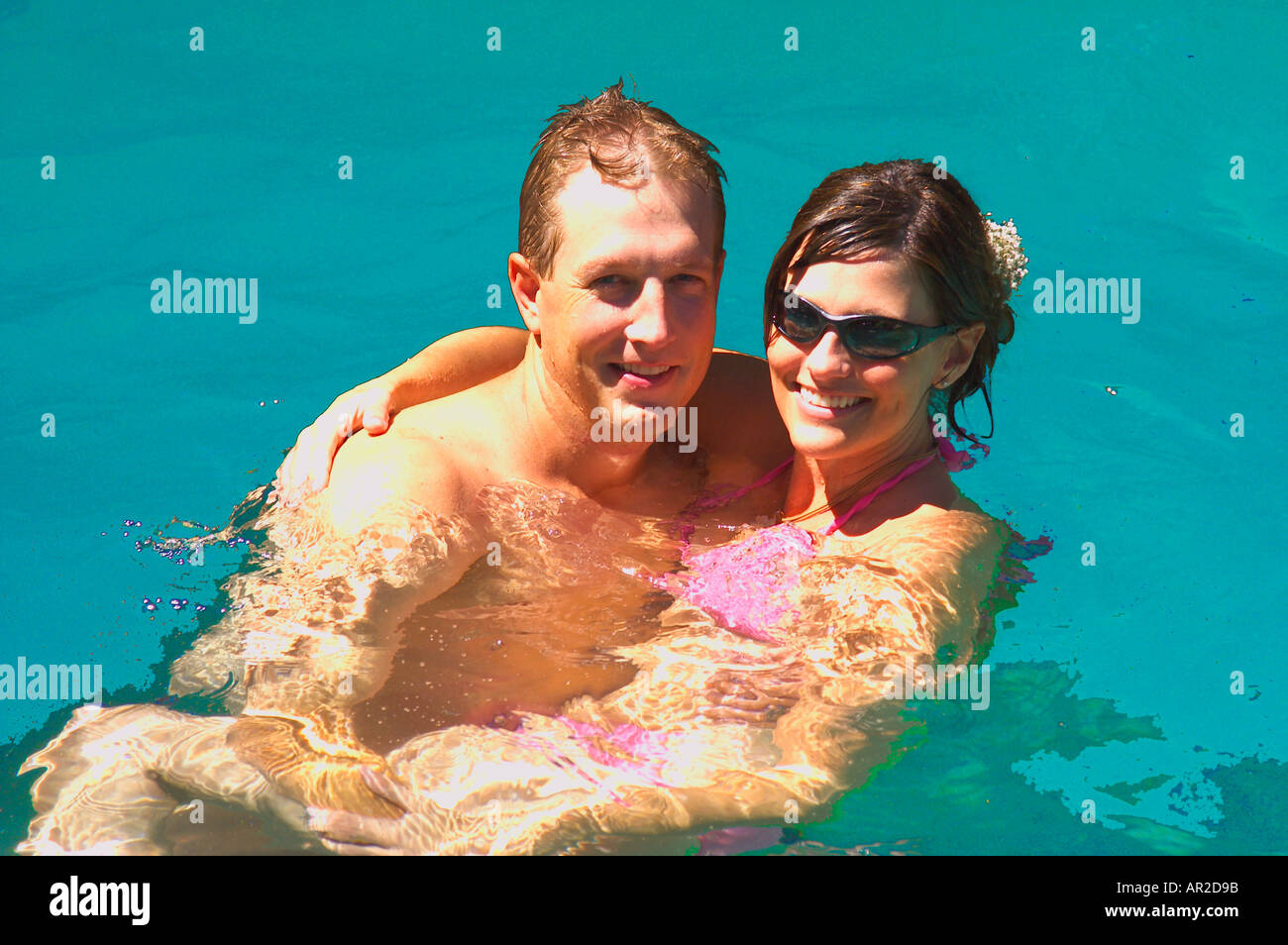 Couple hugging in swimming hi-res stock photography and images - Alamy