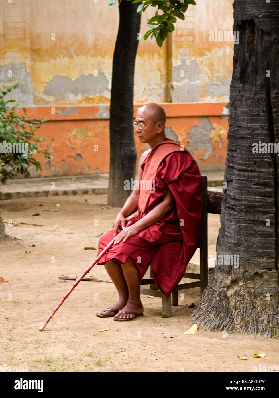Buddhist monk sitting peacefully in garden in Mandalay Stock Photo - Alamy