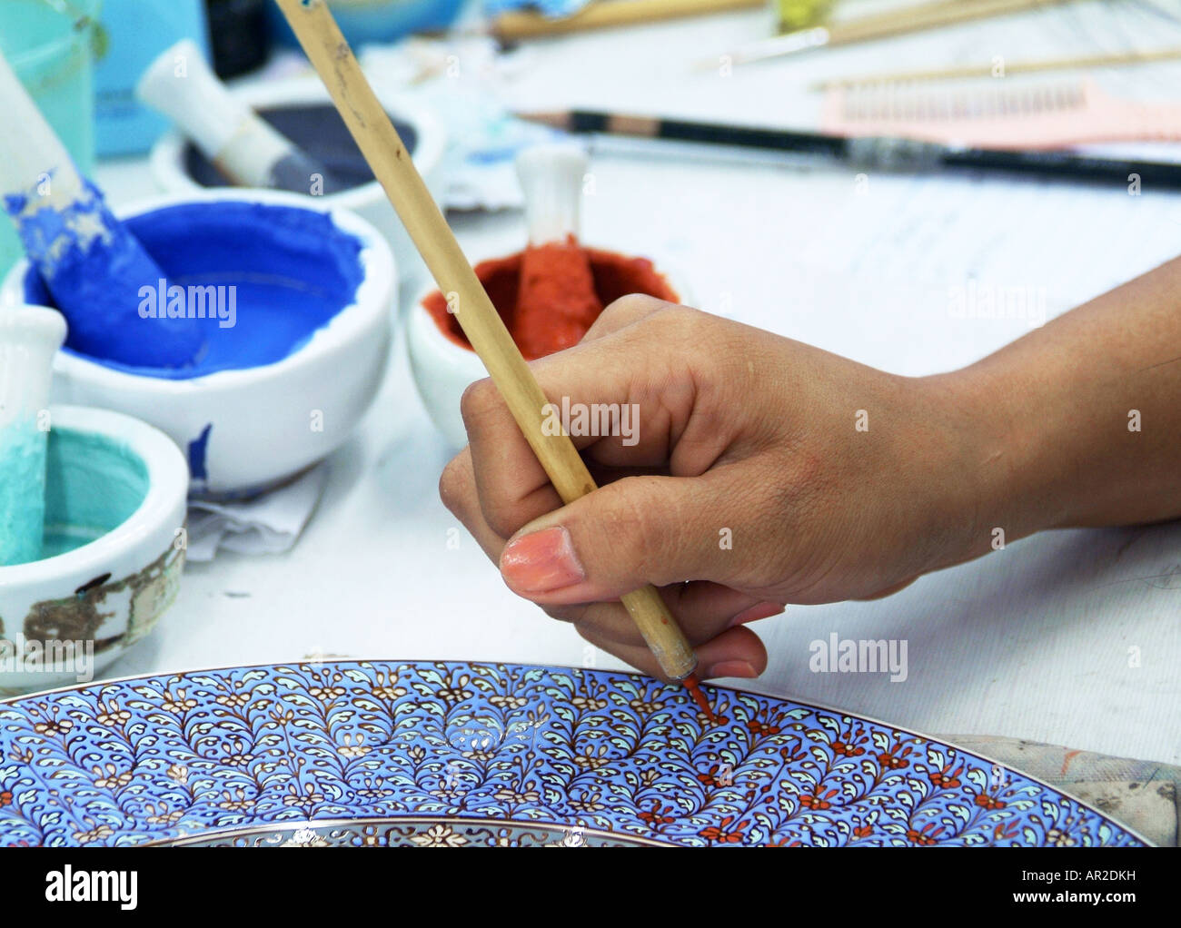 Painting of porcelain by hand Stock Photo - Alamy