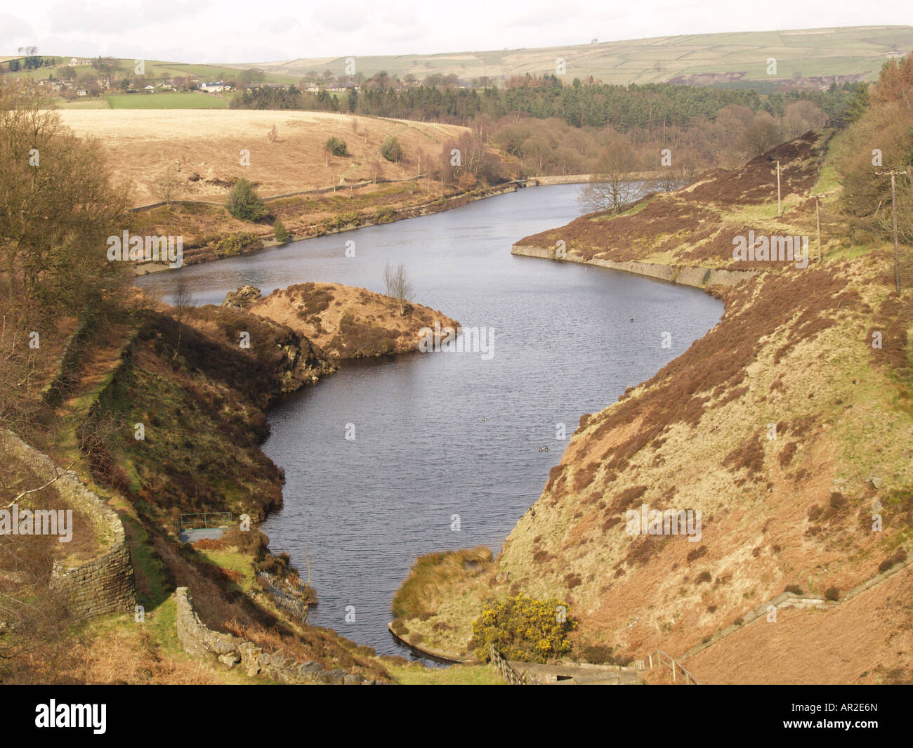 reservoir water reflection ripples trees hillside Stock Photo - Alamy