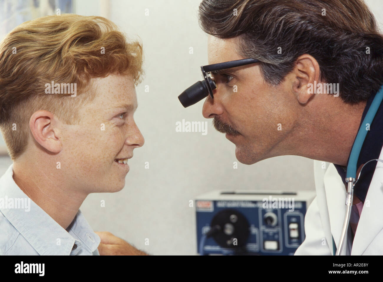 Doctor and young playful patient, physical exam, Miami Stock Photo - Alamy