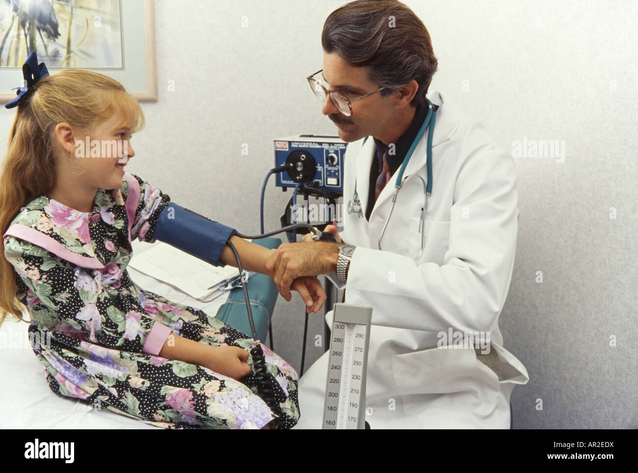 Doctor and young playful patient, physical exam, Miami Stock Photo - Alamy