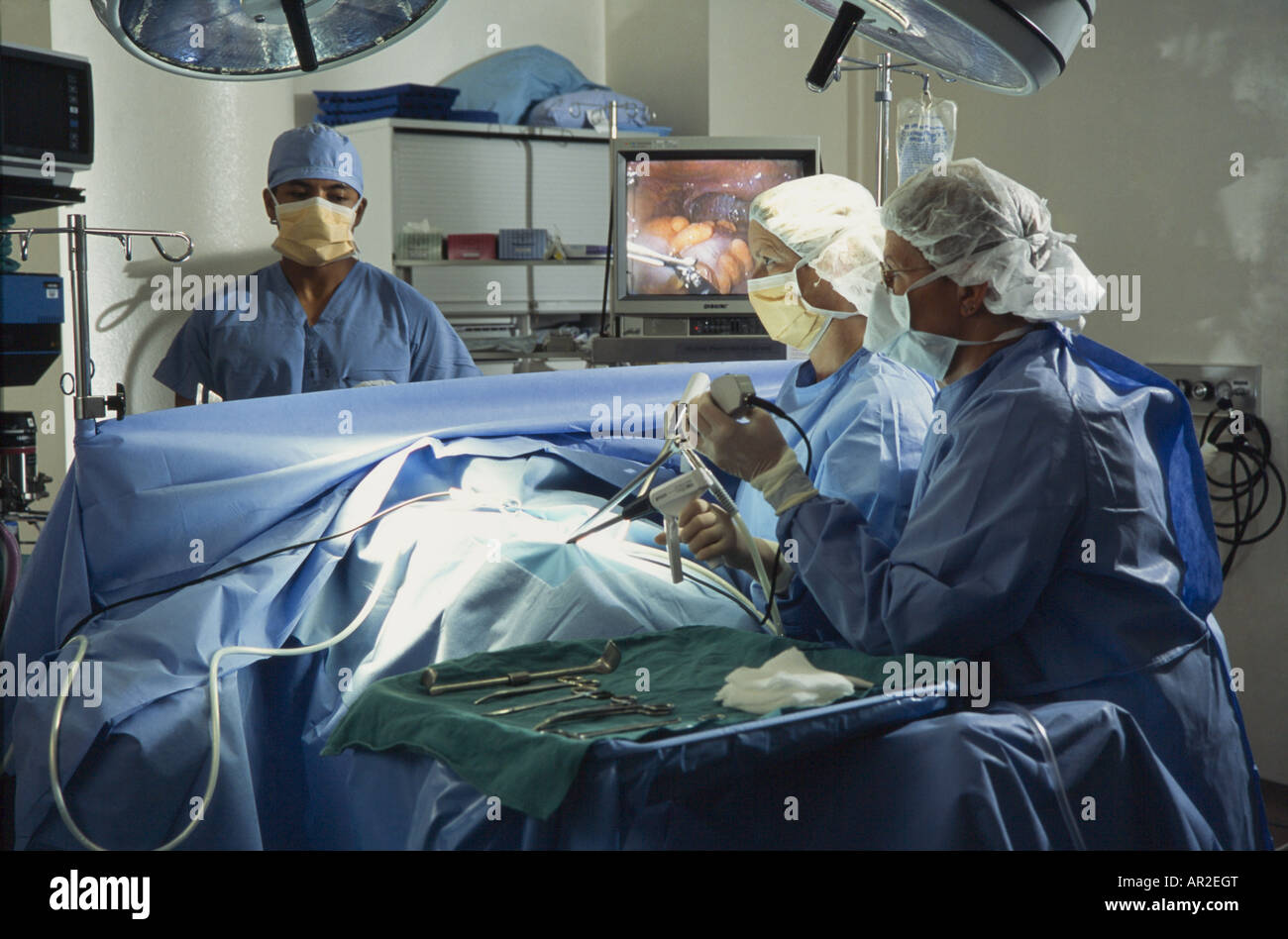 Operation underway in surgical suite, surgeon, performing operation ...