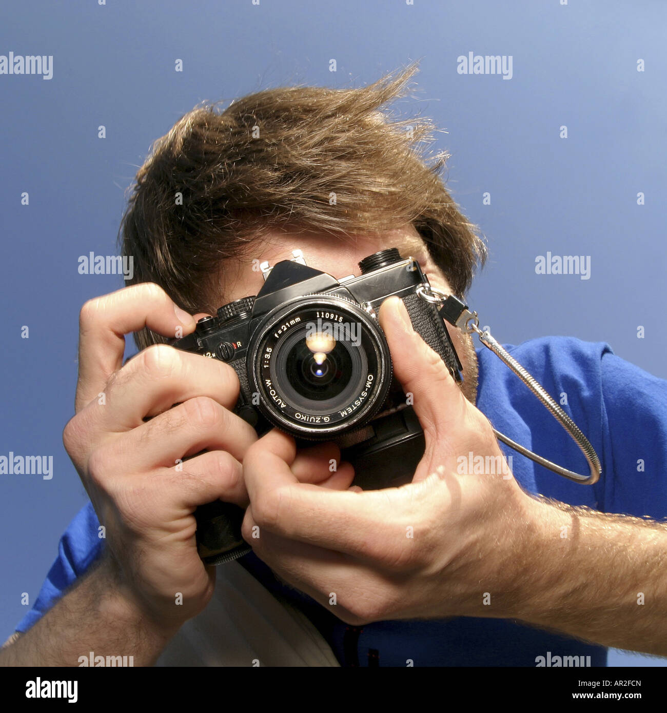 man shooting into the camera Stock Photo - Alamy
