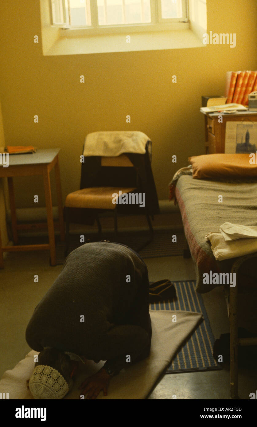 Muslim prisoner at prayer in his cell, C Wing, Wormwood Scrubs ...