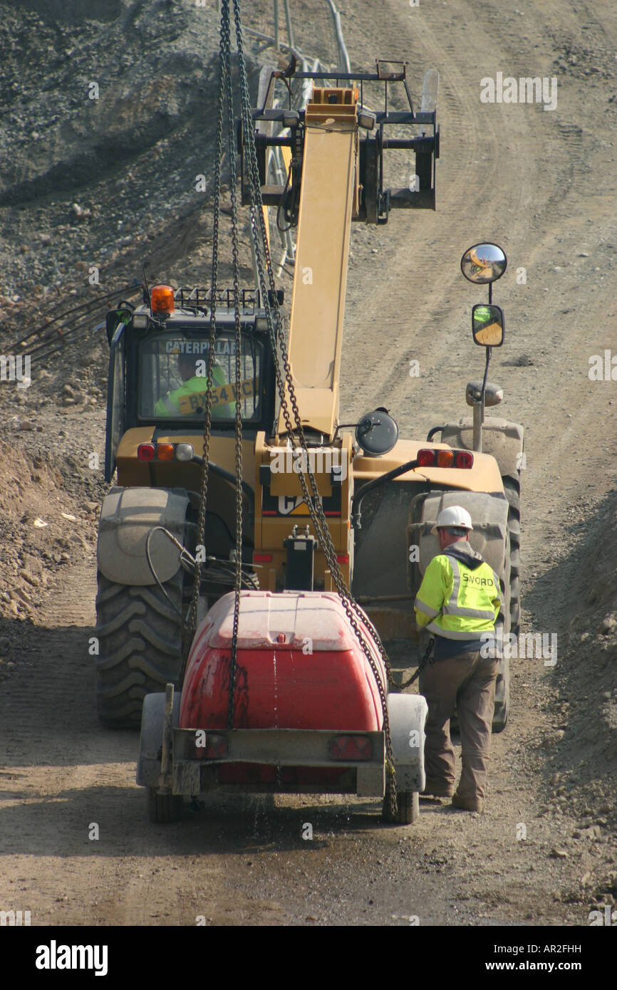 machinery road construction site cherry picker Stock Photo - Alamy