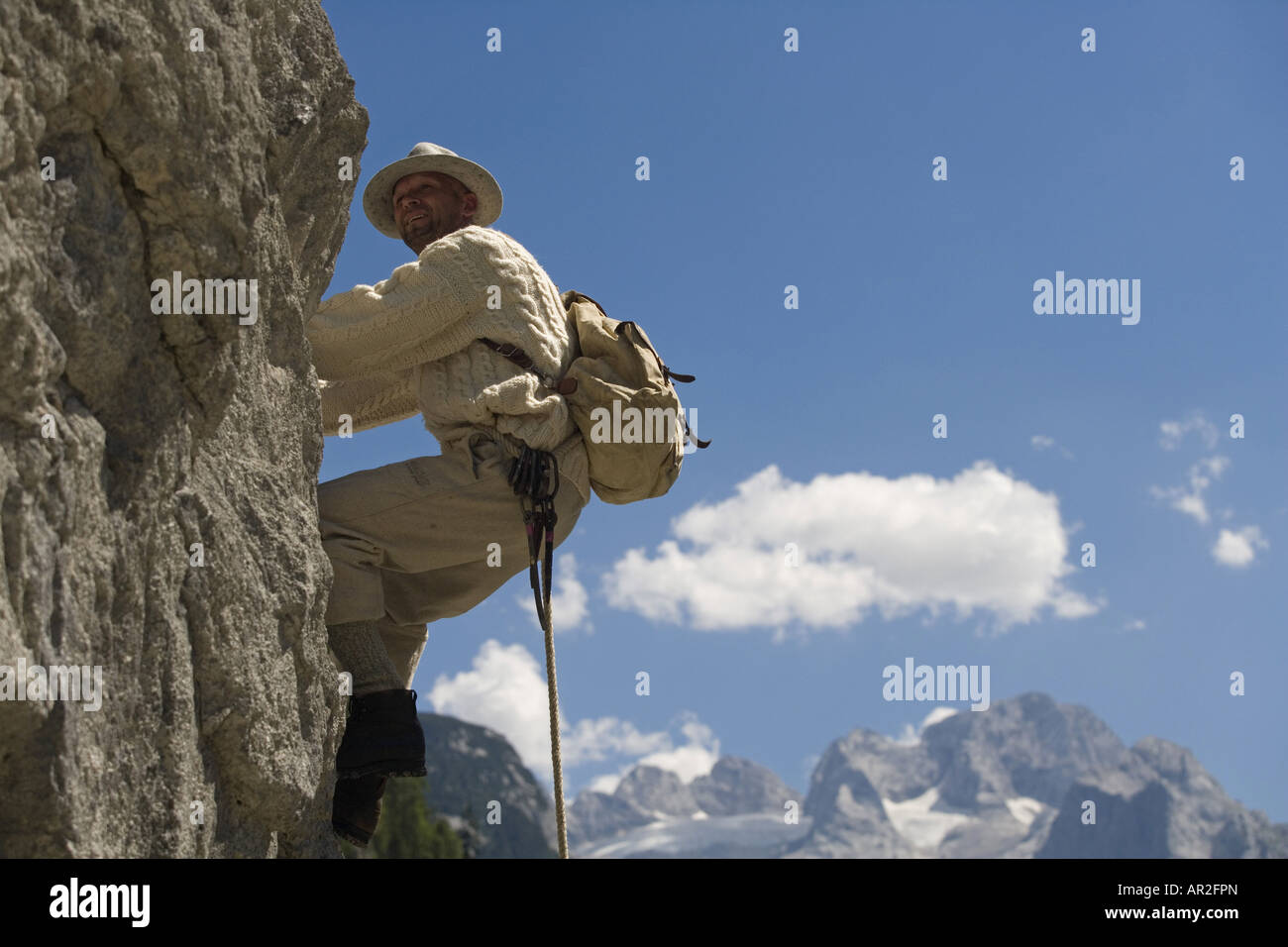 historic mountain climber climbing at a rock wall, Austria, Gosautal ...