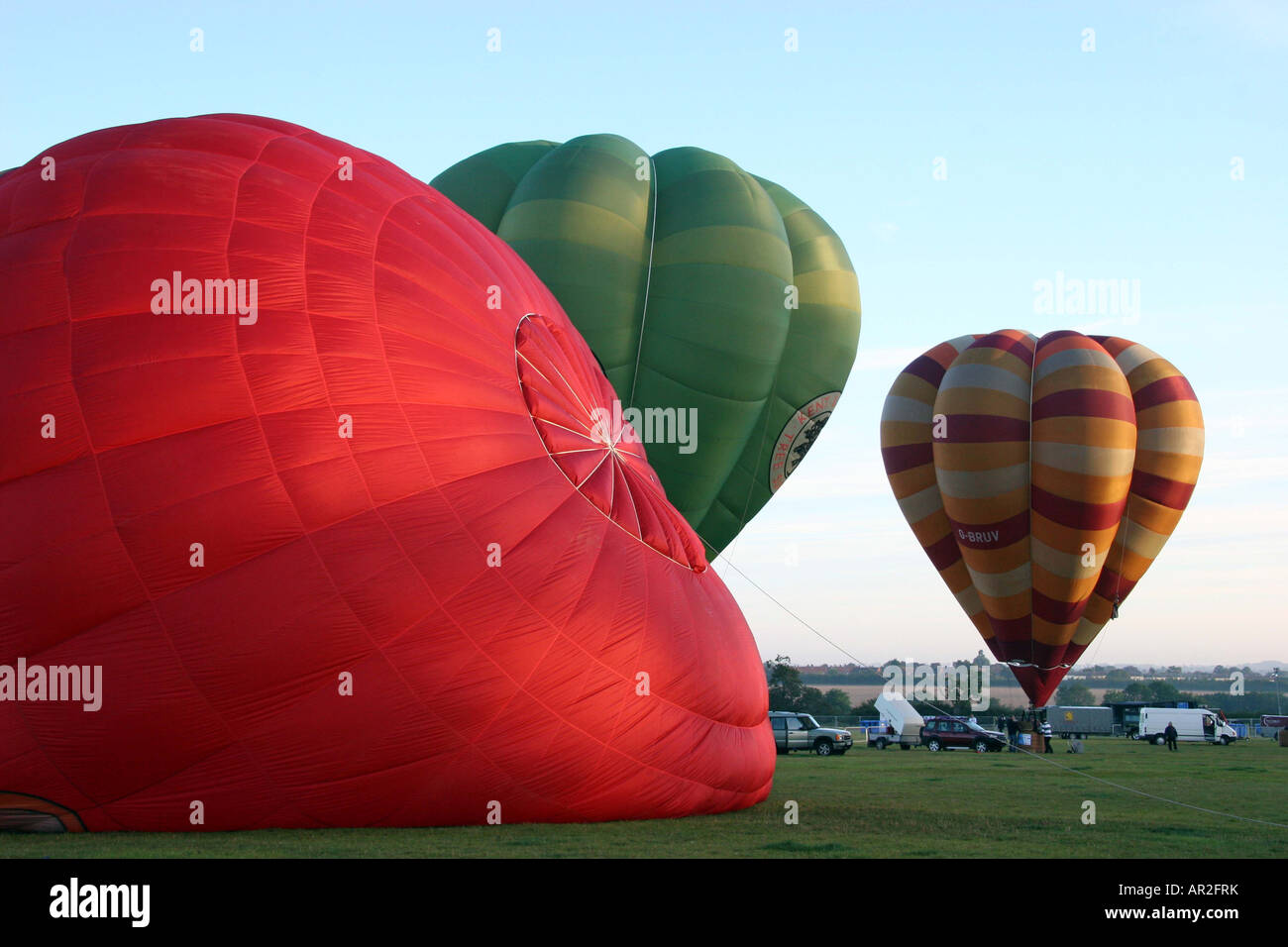 three balloons prepare for take off in the dawn light Stock Photo - Alamy