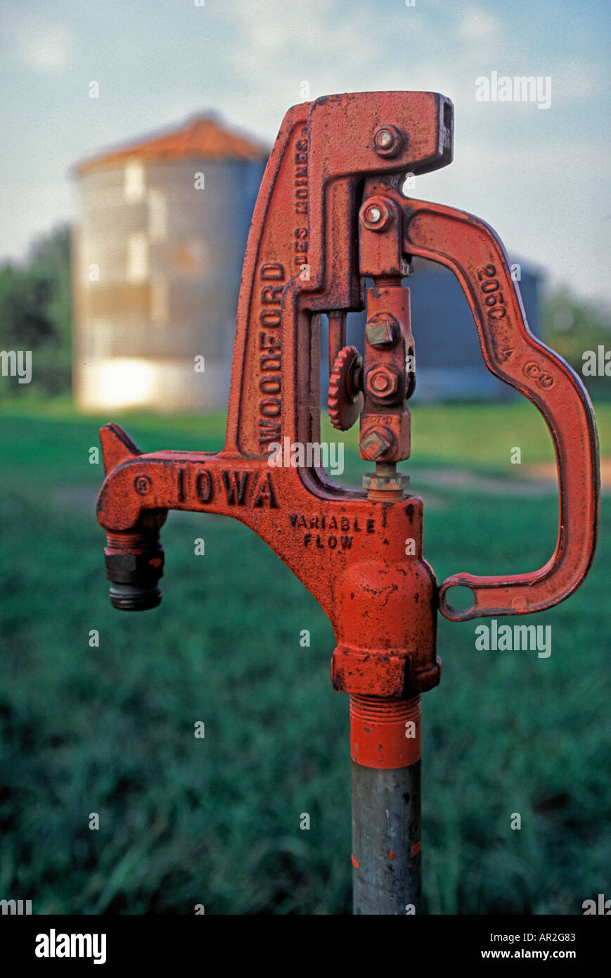 Water hydrant on farm Grain bins in the background Nebraska USA Stock ...