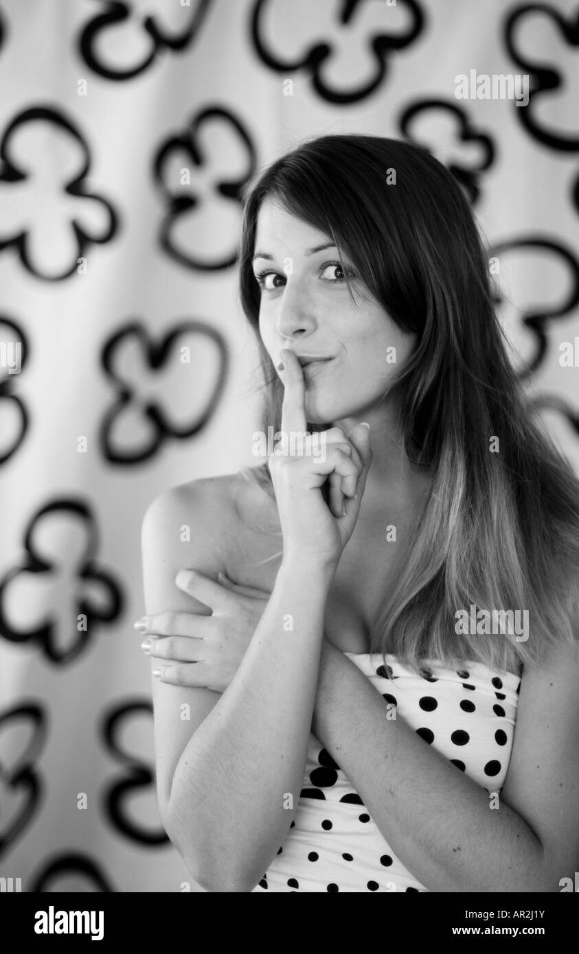 Young woman shushing hi-res stock photography and images - Alamy