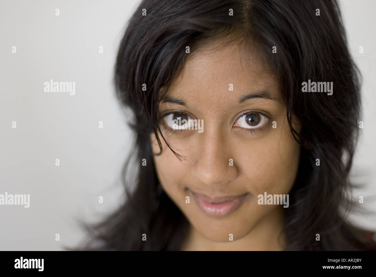 portrait of a dark-skinned woman with long hair Stock Photo - Alamy