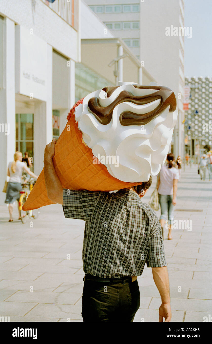 Man carrying large plastic ice cream Stock Photo - Alamy