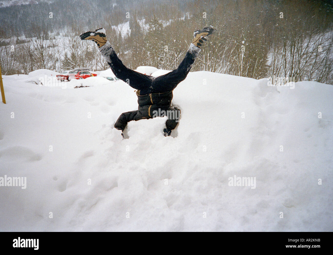 Man with head buried in pile of snow Stock Photo - Alamy