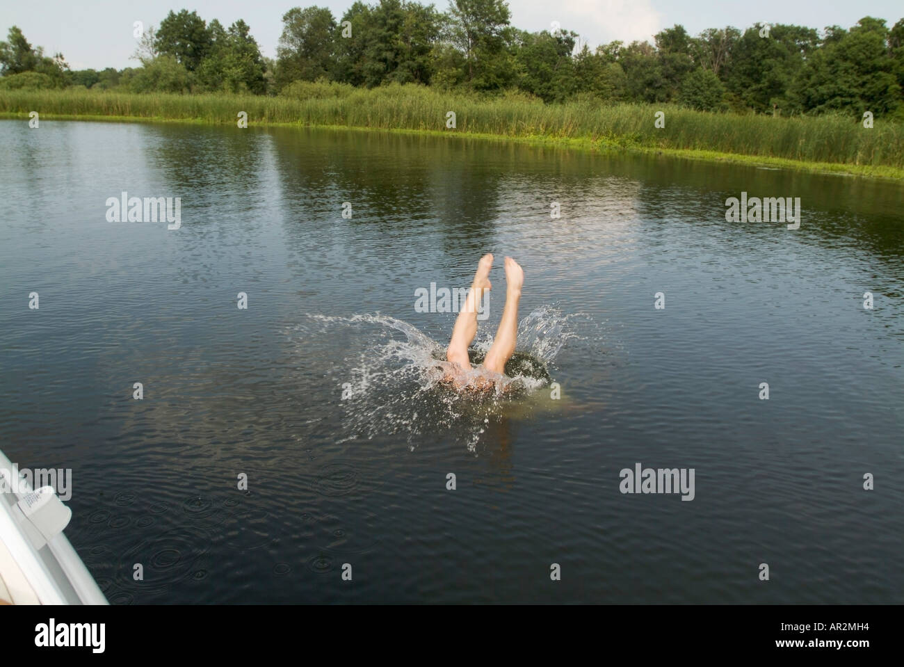 Man diving into water Stock Photo - Alamy
