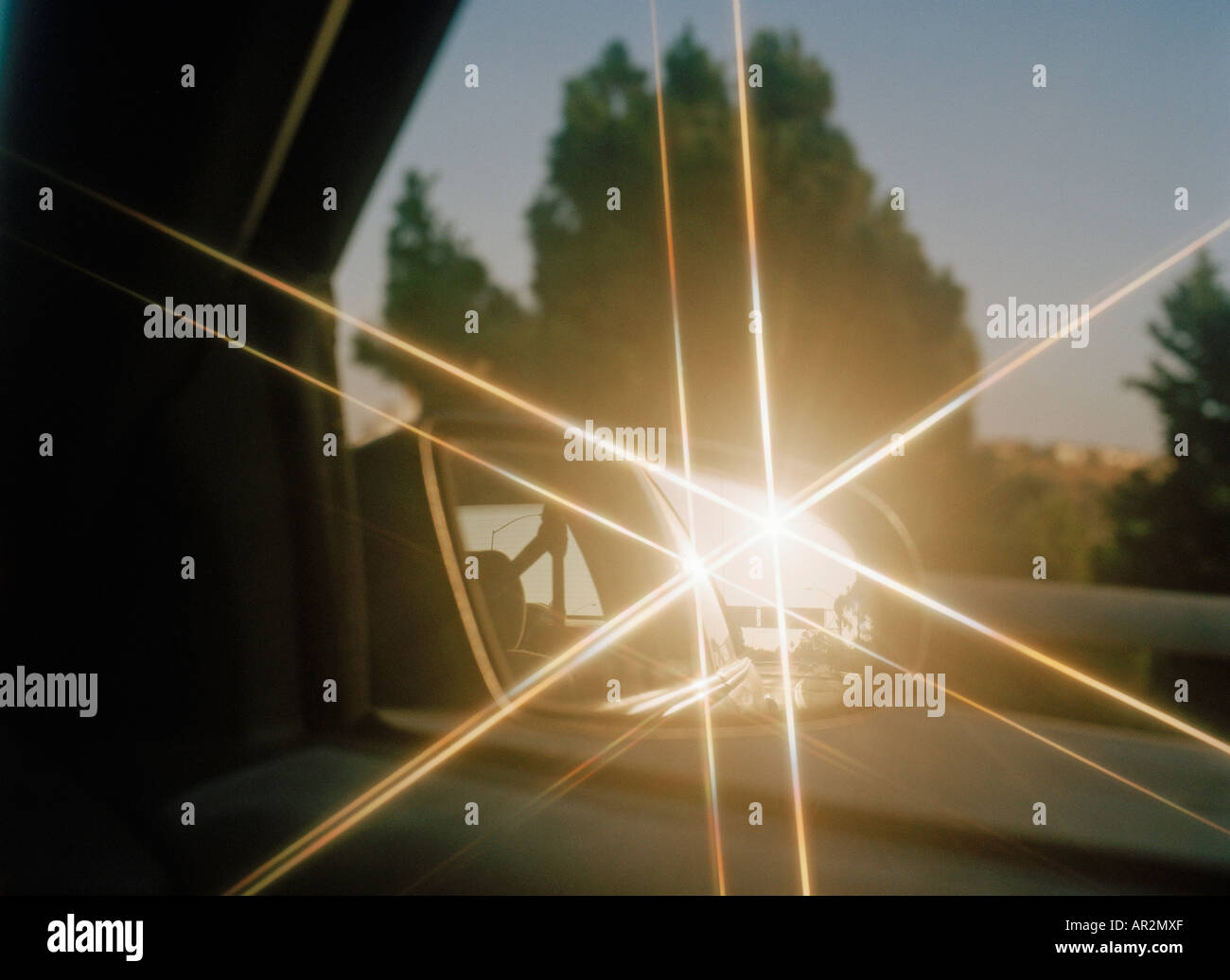 Sun reflecting in car mirror hi-res stock photography and images - Alamy