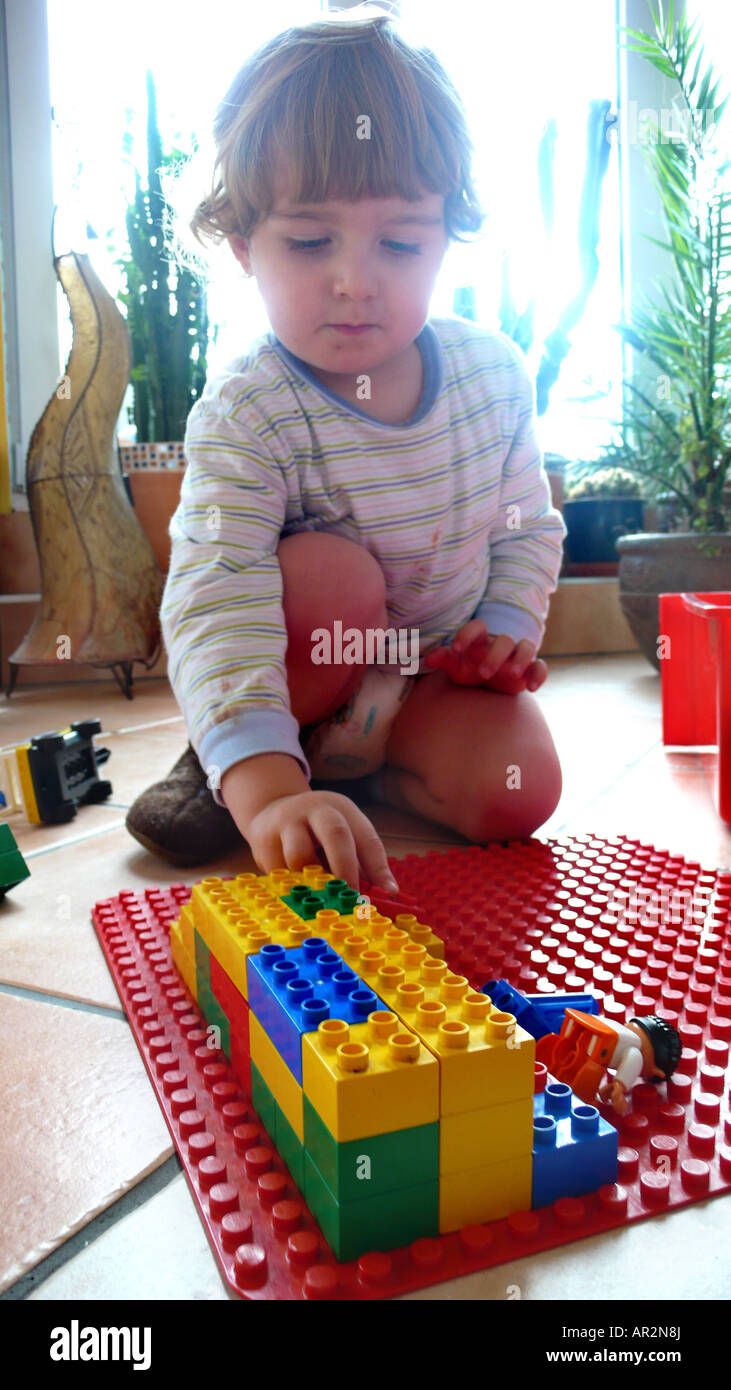 little boy playing with Lego bricks Stock Photo - Alamy