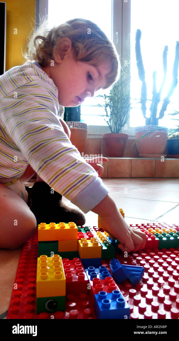 little boy playing with Lego bricks Stock Photo - Alamy