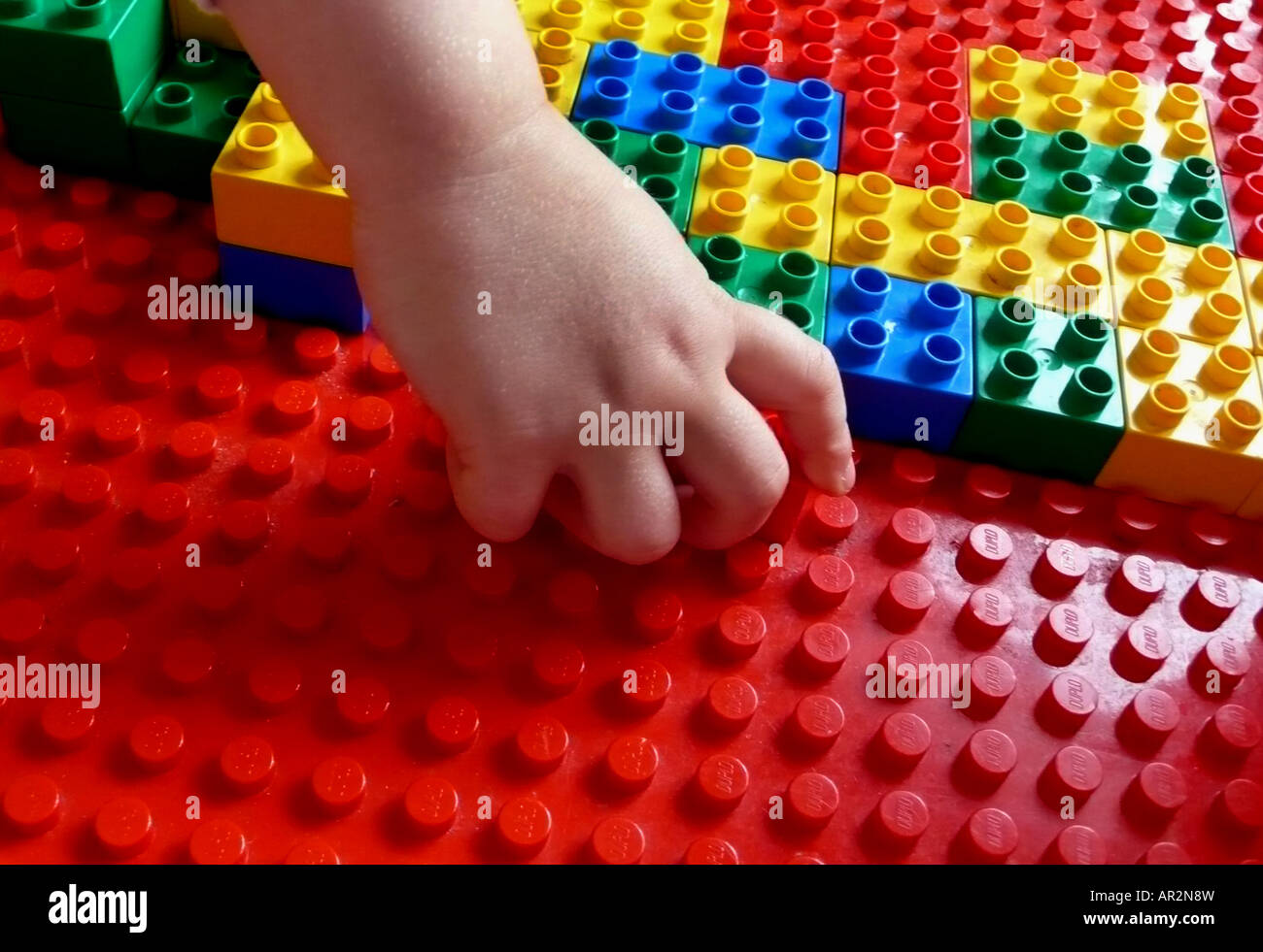 little boy playing with Lego bricks Stock Photo - Alamy