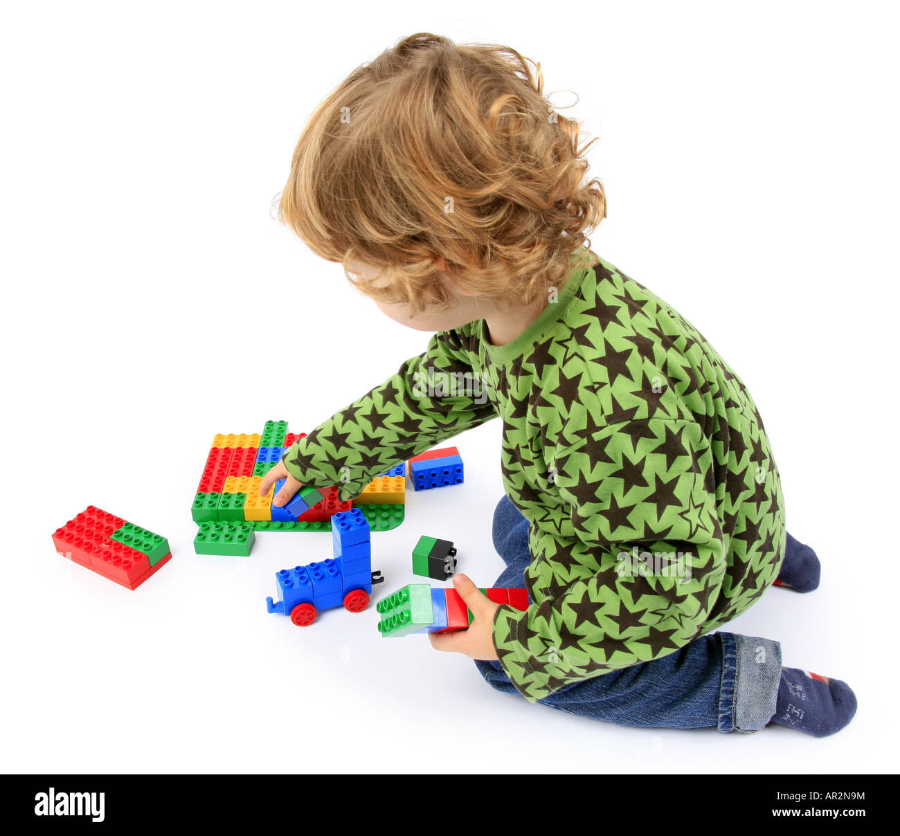 little boy playing with Lego bricks Stock Photo - Alamy