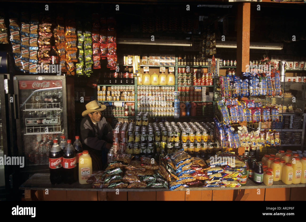 Simple roadside grocery kiosk and worker, Guatemalan Highlands, Central ...