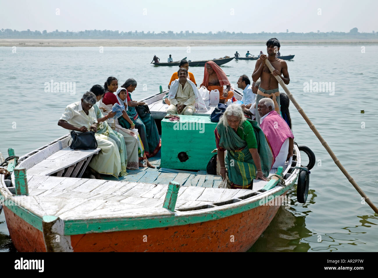 Hindu pilgrims visiting the river by boat. Shivala Ghat. Ganges river ...
