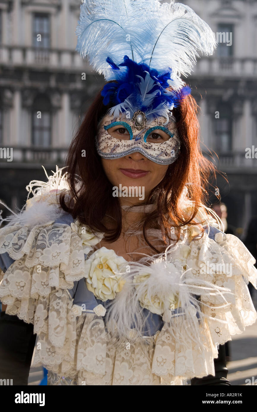 Reveller in mask and costume at the Venice carnival, in St Mark's ...