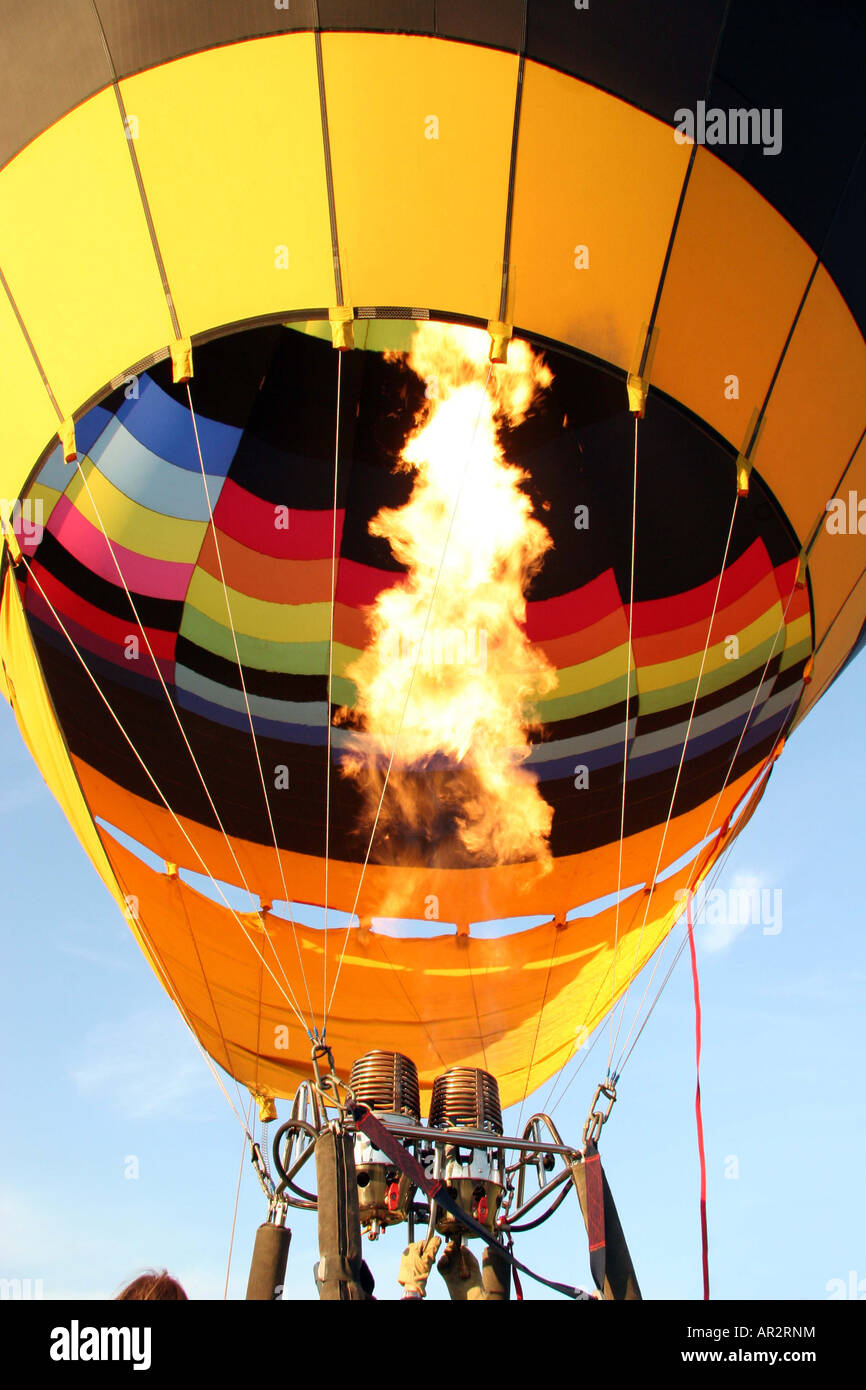 Flames shoot up into the balloon as the burners are fired on a hot air ...
