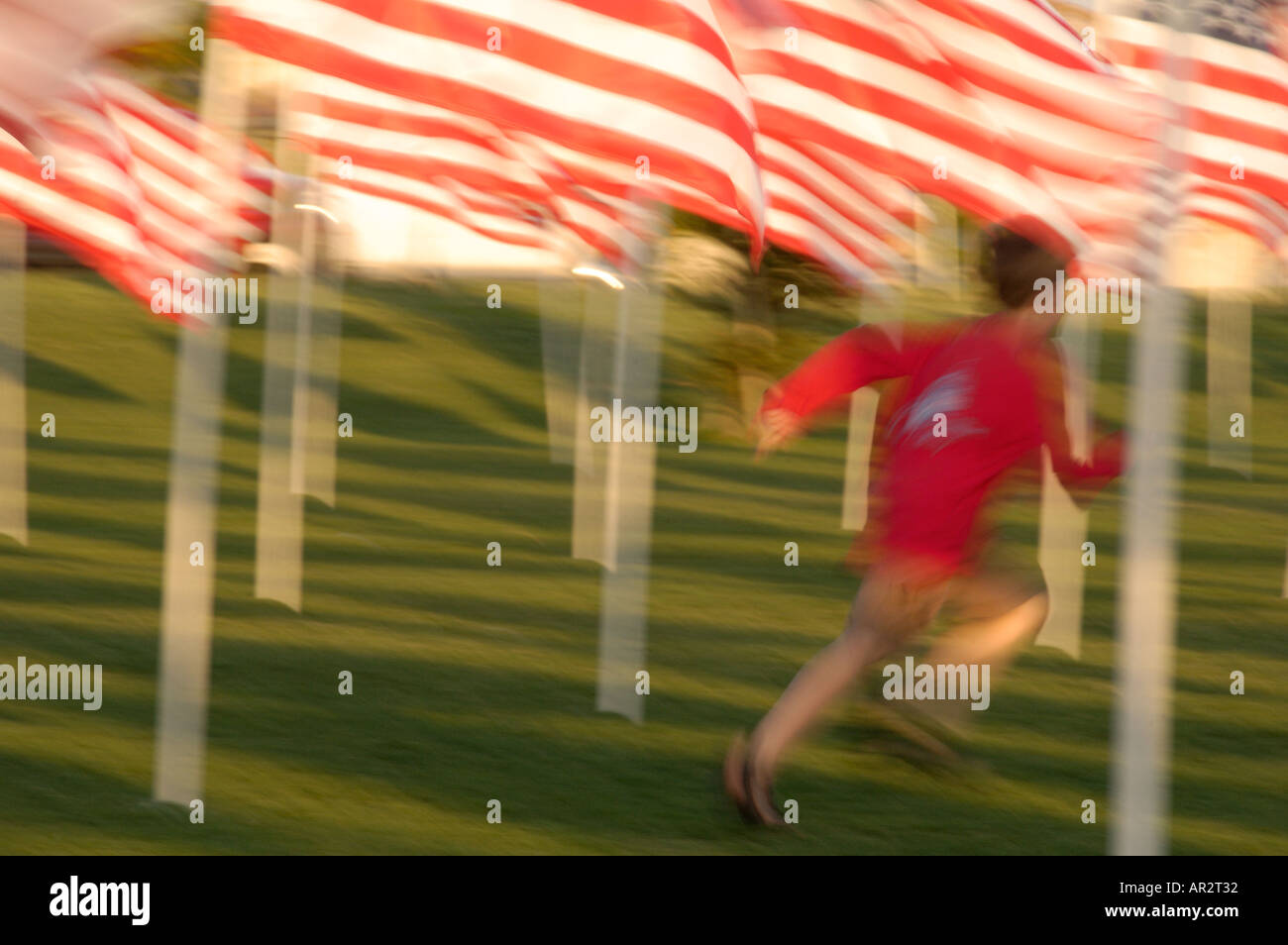 Boy Runnig Through Waving American Flags Stock Photo - Alamy