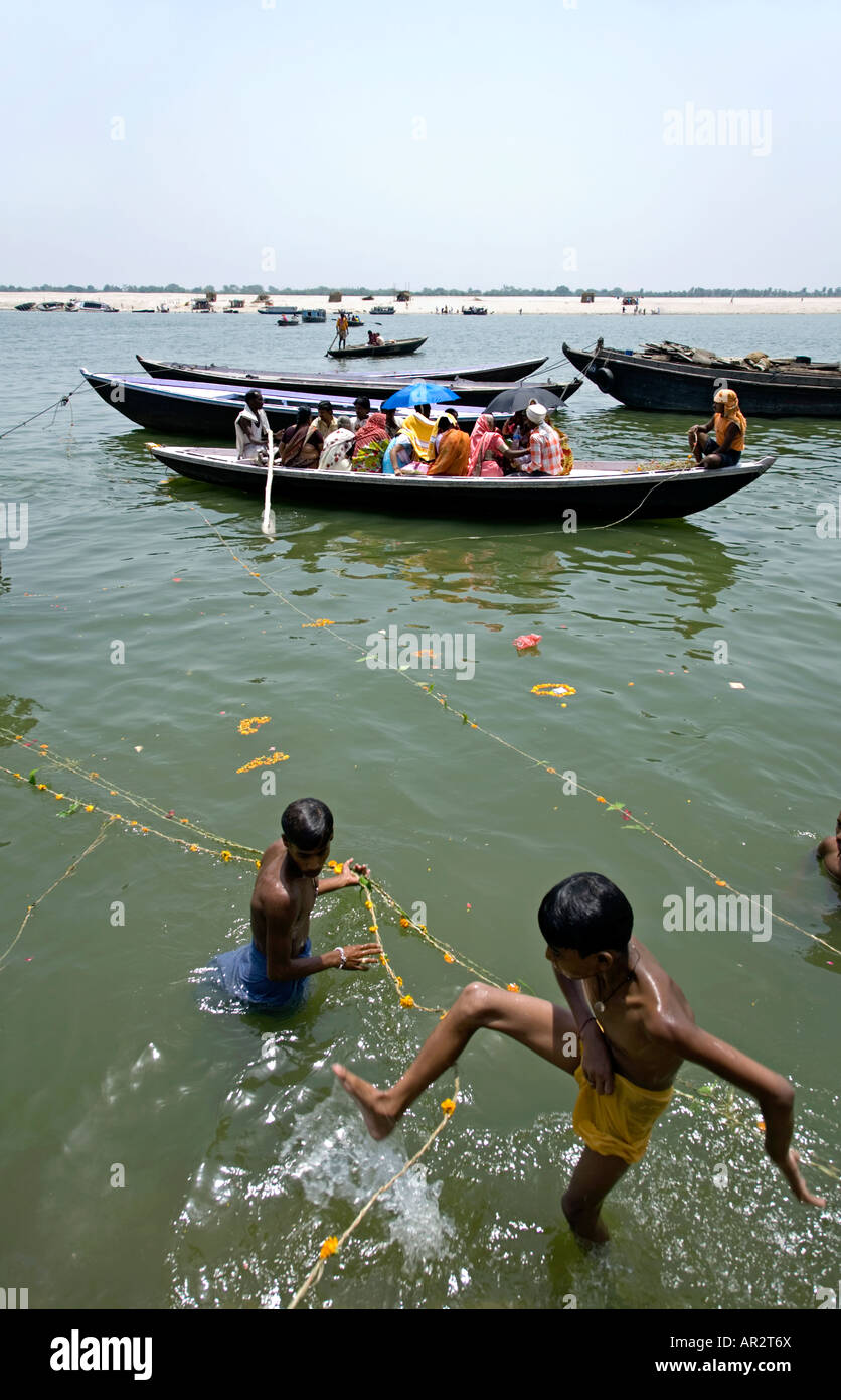Kids playing and boat. Dasaswamedh Ghat. Ganges river. Varanasi. India ...