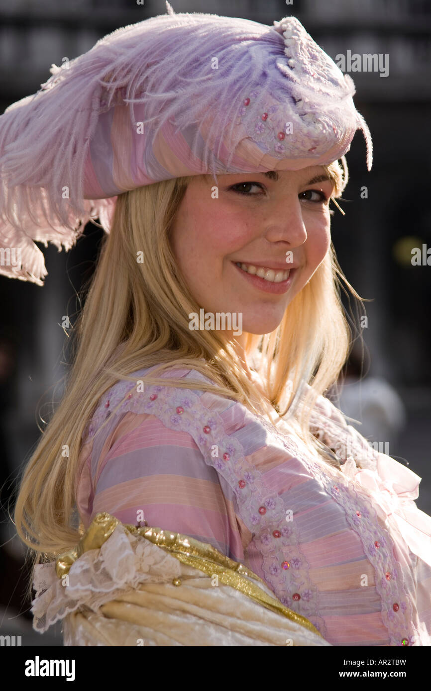 Pretty female reveller in mask and costume at the Venice carnival, in ...