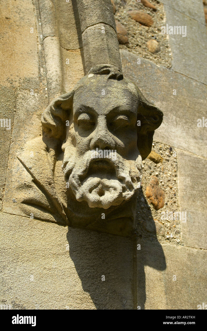 gargoyle of a saint on a church Stock Photo - Alamy