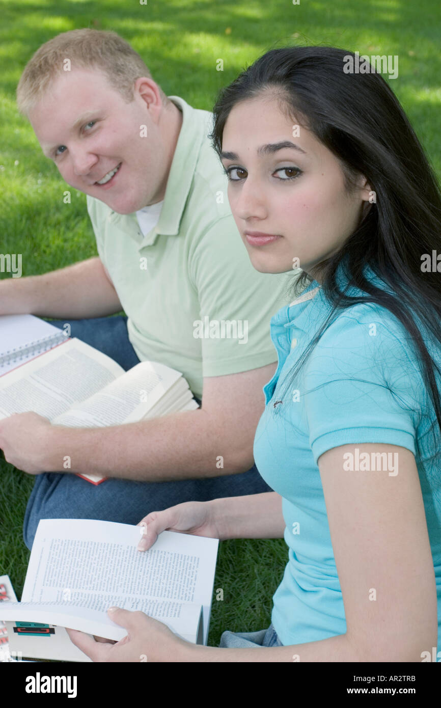 Two students studying together outdoors Stock Photo - Alamy