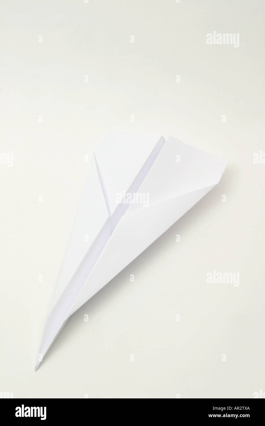 Paper plane on white paper Stock Photo - Alamy