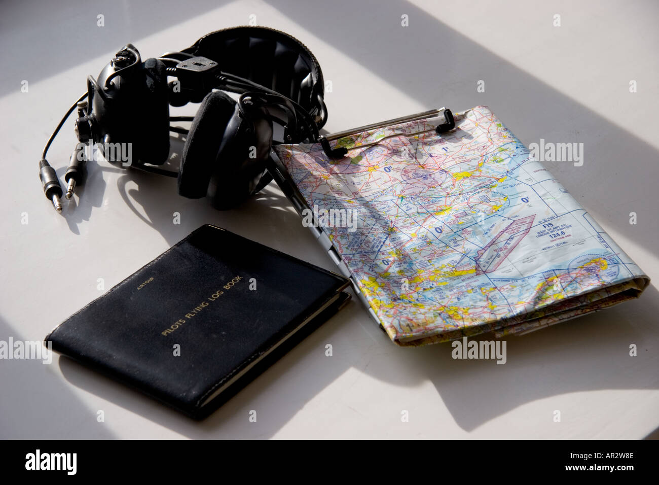 Aviation pilot headset navigation chart and flying log book Stock Photo ...