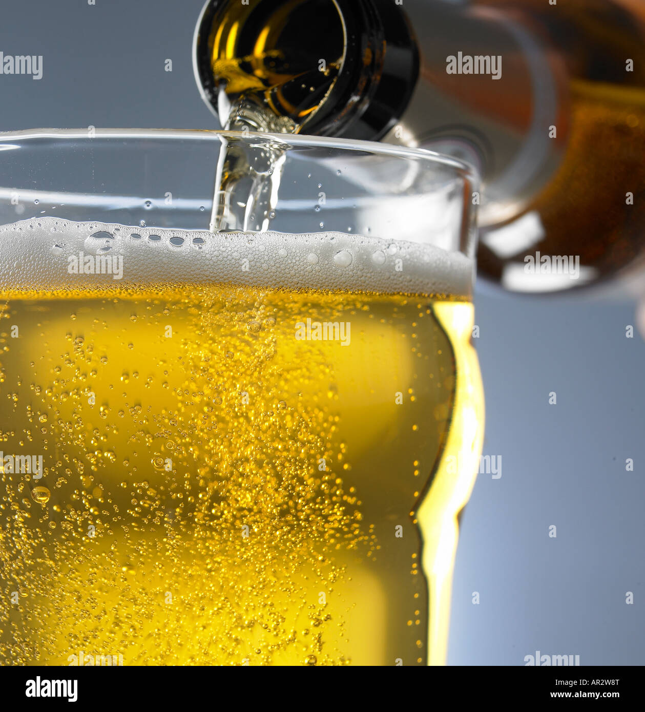 pouring a Pint of Lager Stock Photo - Alamy