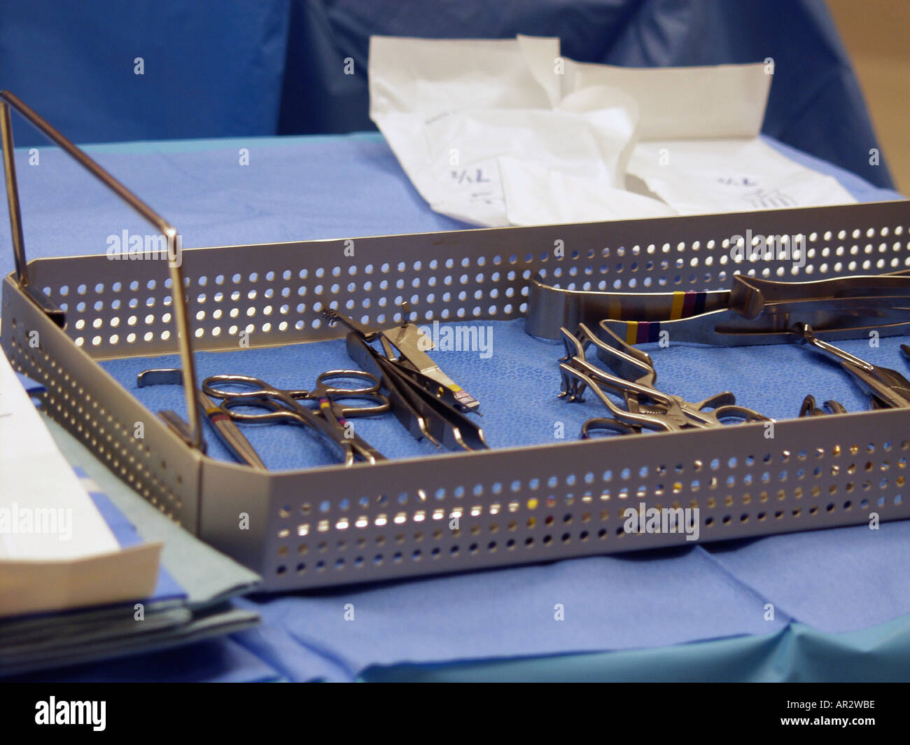 surgical instruments in tray on sterile drape Stock Photo - Alamy