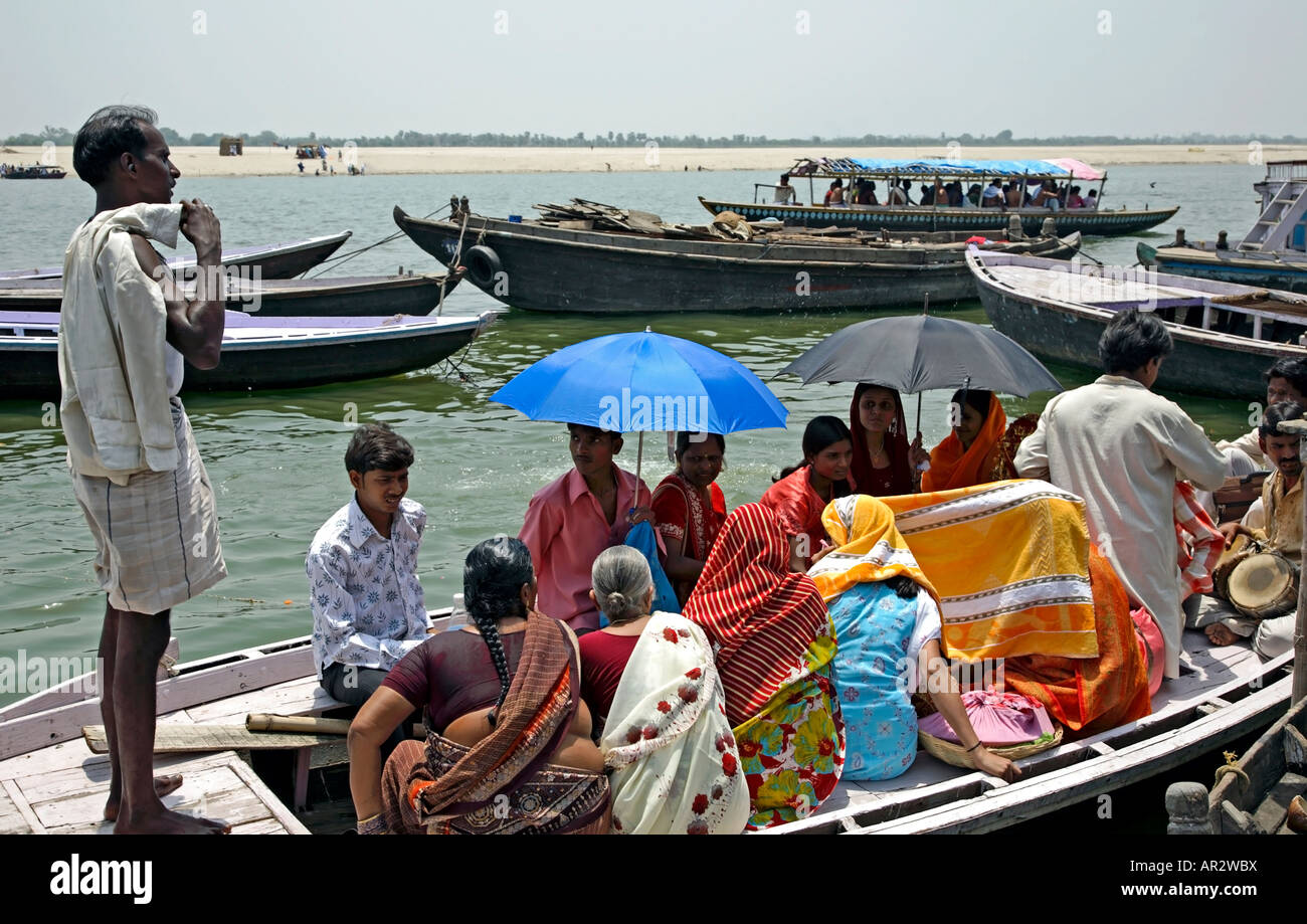 Hindu pilgrims visiting the Ganges river by boat. Dasaswamedh Ghat ...