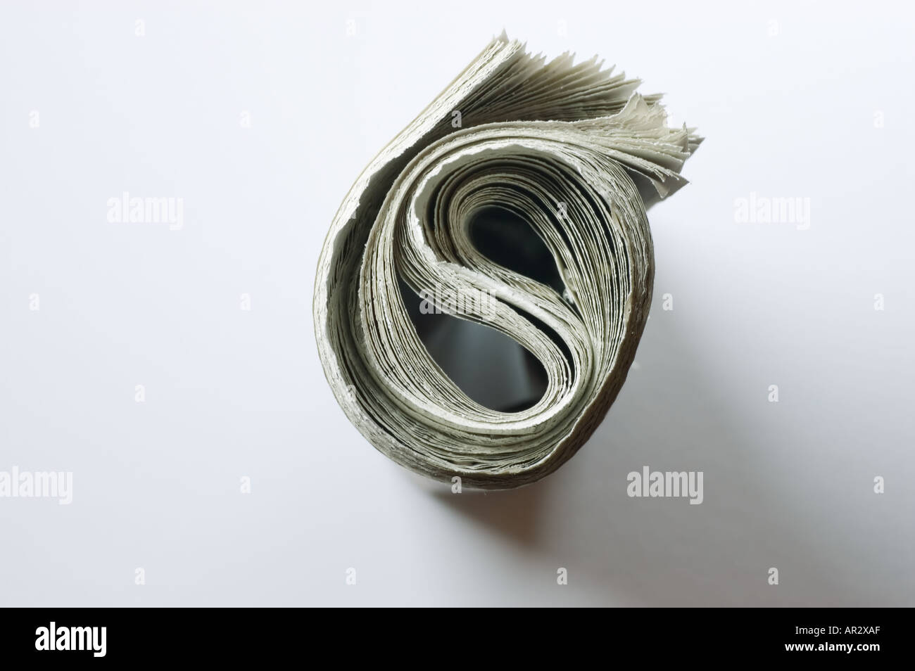 Rolled up newspaper Stock Photo - Alamy