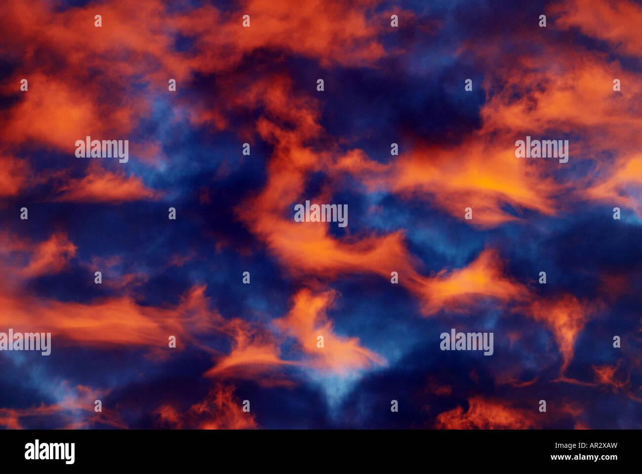 Fiery cloud patterns at sunset Stock Photo - Alamy