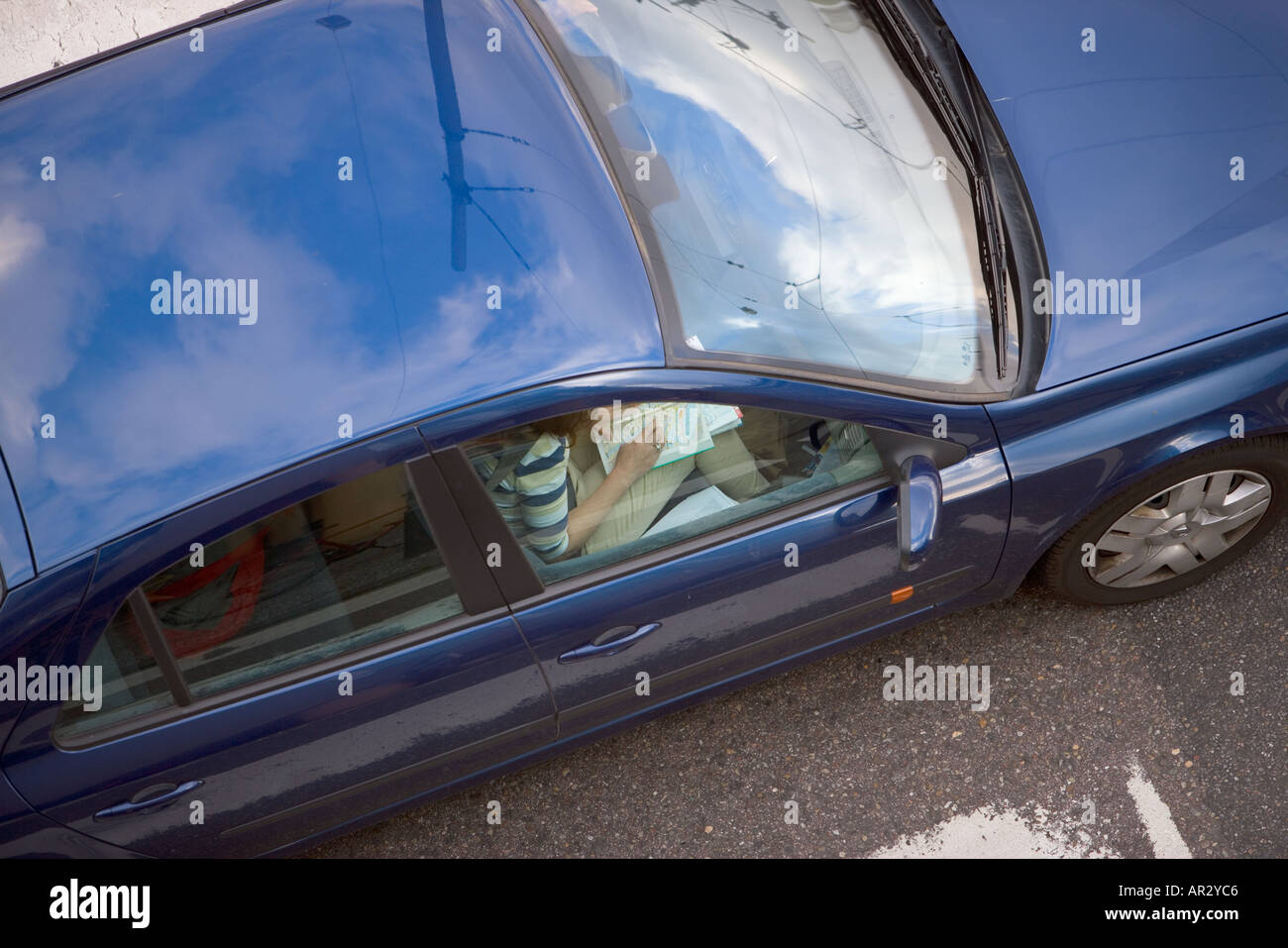 Reading in a car hi-res stock photography and images - Alamy